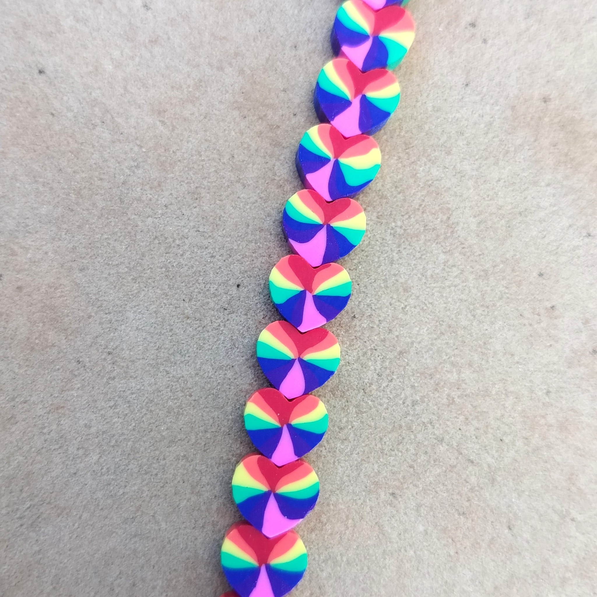 Polymer Clay Heart Rainbow Twist Bead Strand of 17 - Bead Inspirations