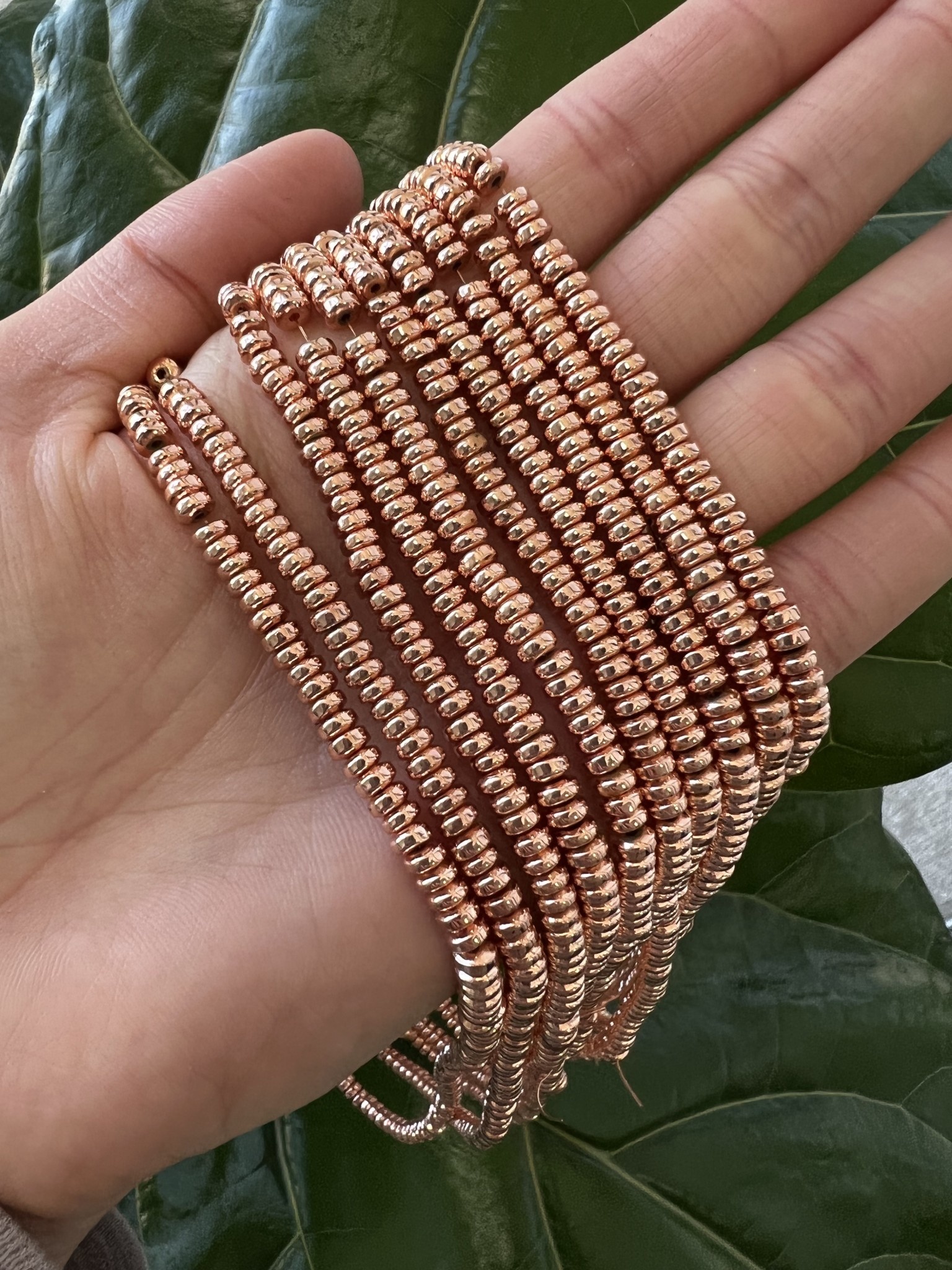 Rose Gold Hematite Rondelle, Polished 15" Strand - The Raw Rock Shop Inc.