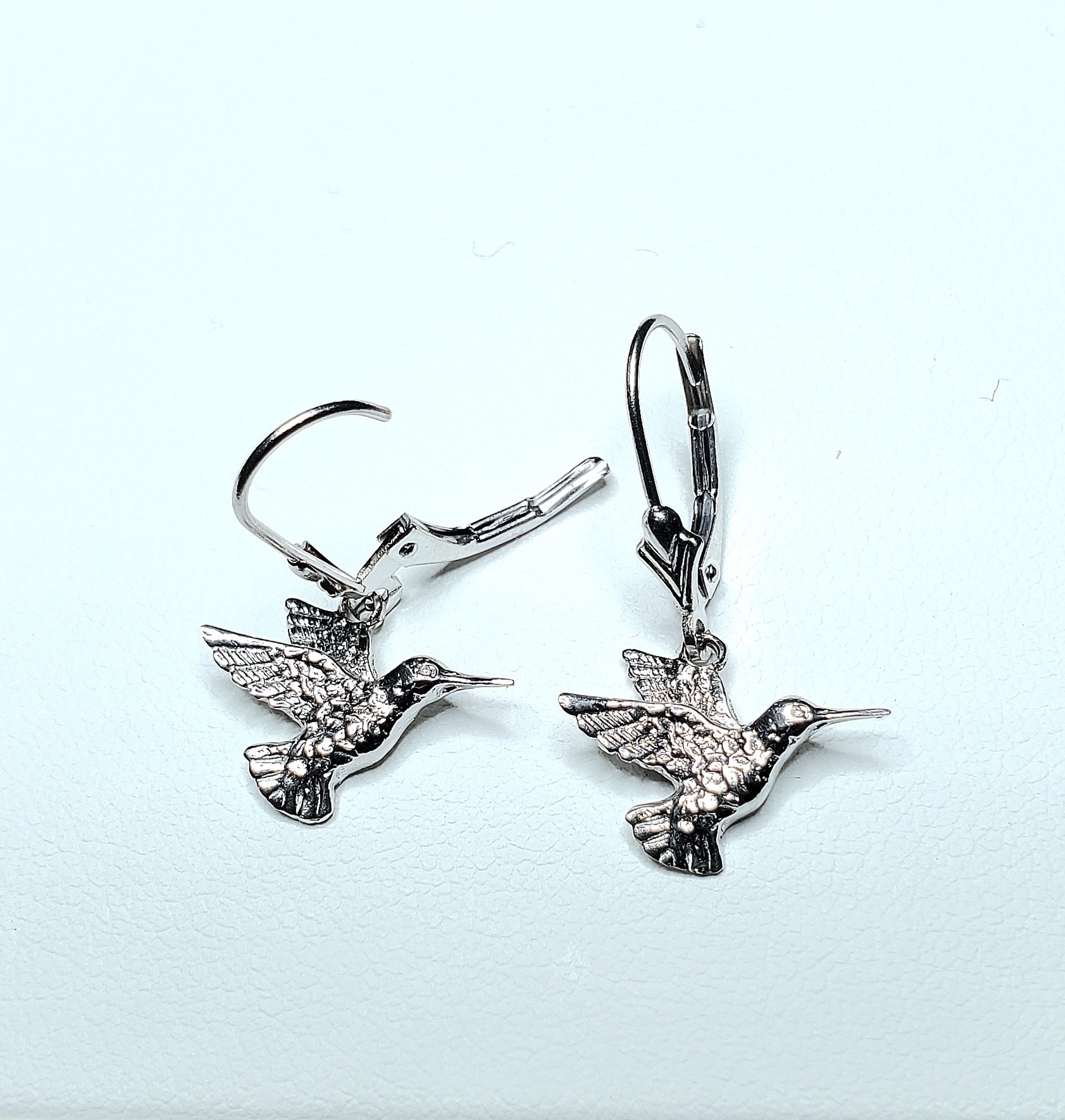 Hummingbird dangle earrings store